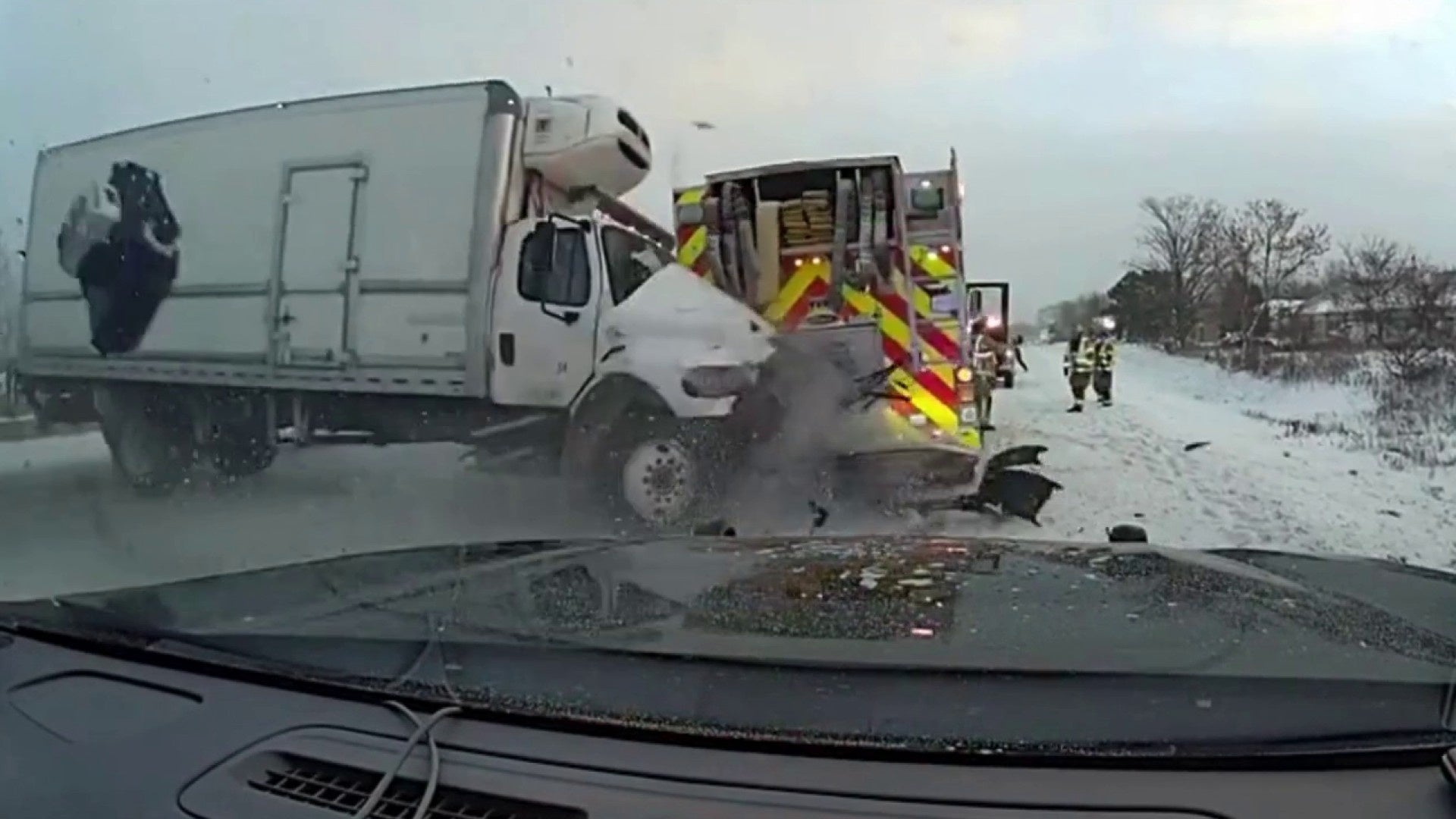 Box truck crashes into first responders' vehicles during winter storm ...
